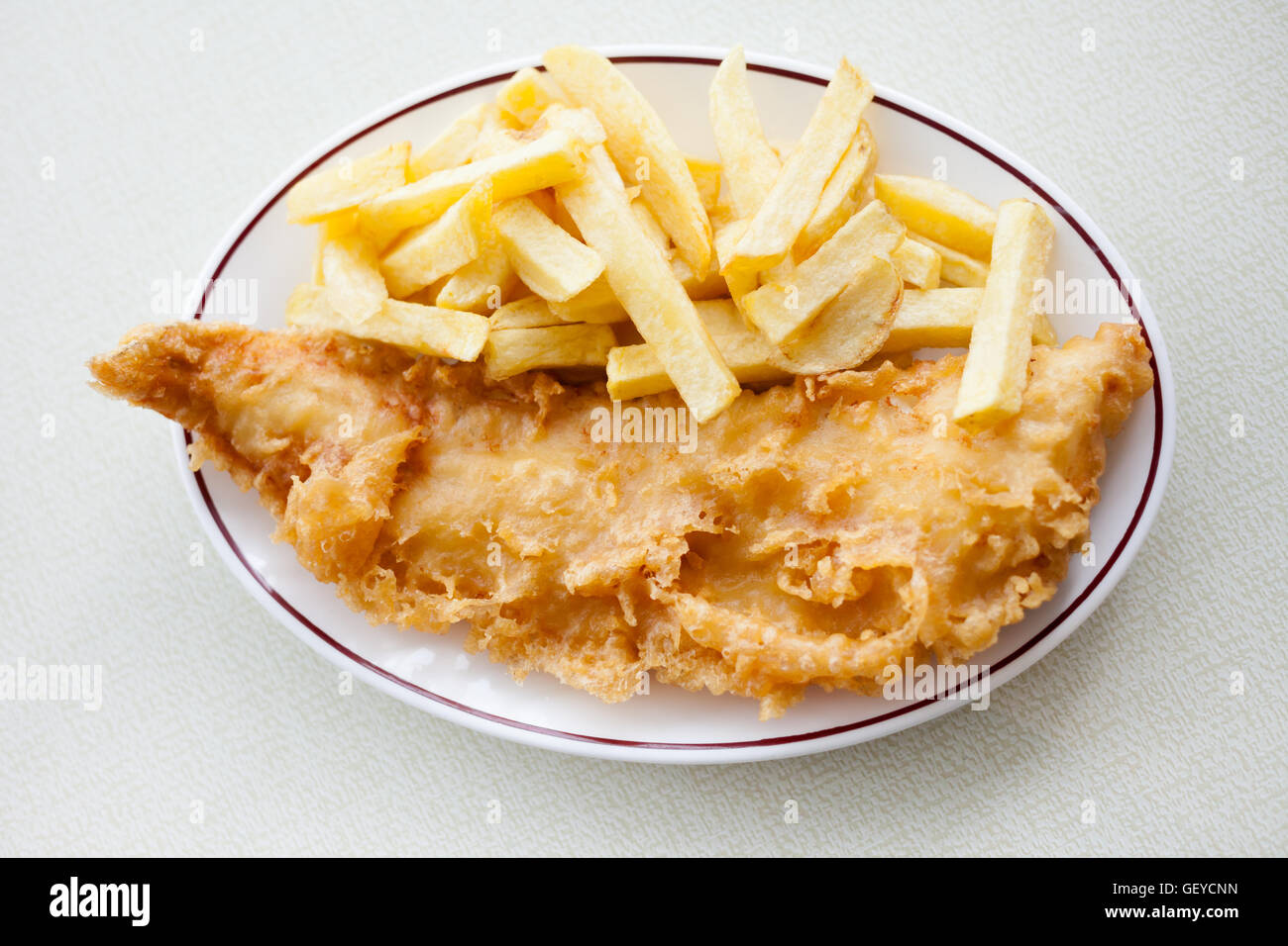 Traditional english meal - deep fried fish, cod with chips served in ...