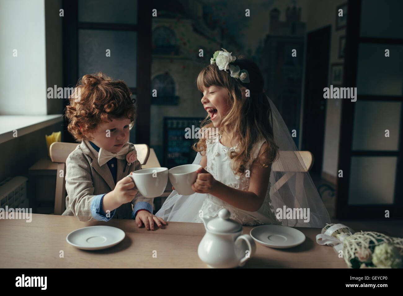 Kids having tea hi-res stock photography and images - Alamy