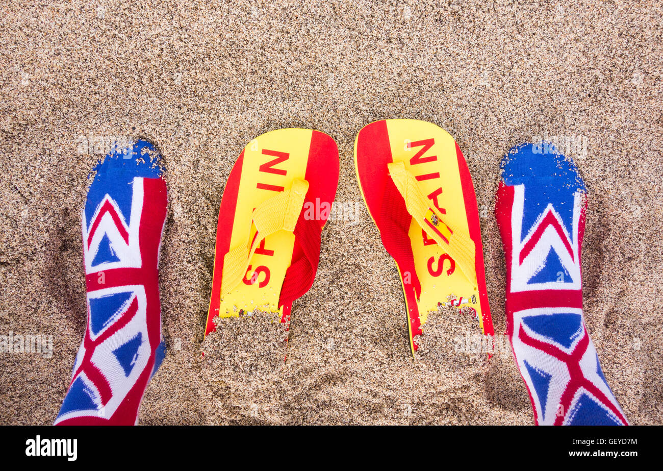 British tourist wearing Union Jack socks on beach: Spanish flag flip ...