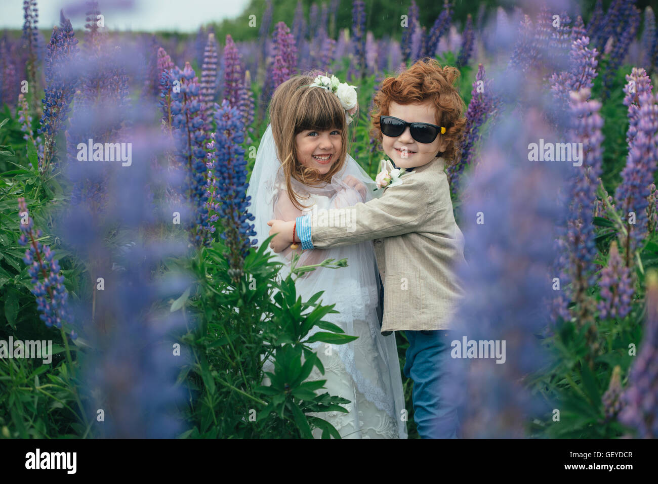 two funny little bride and groom Stock Photo - Alamy