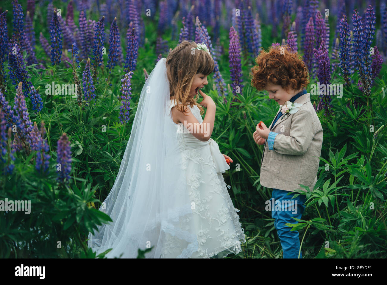 two funny little bride and groom Stock Photo - Alamy