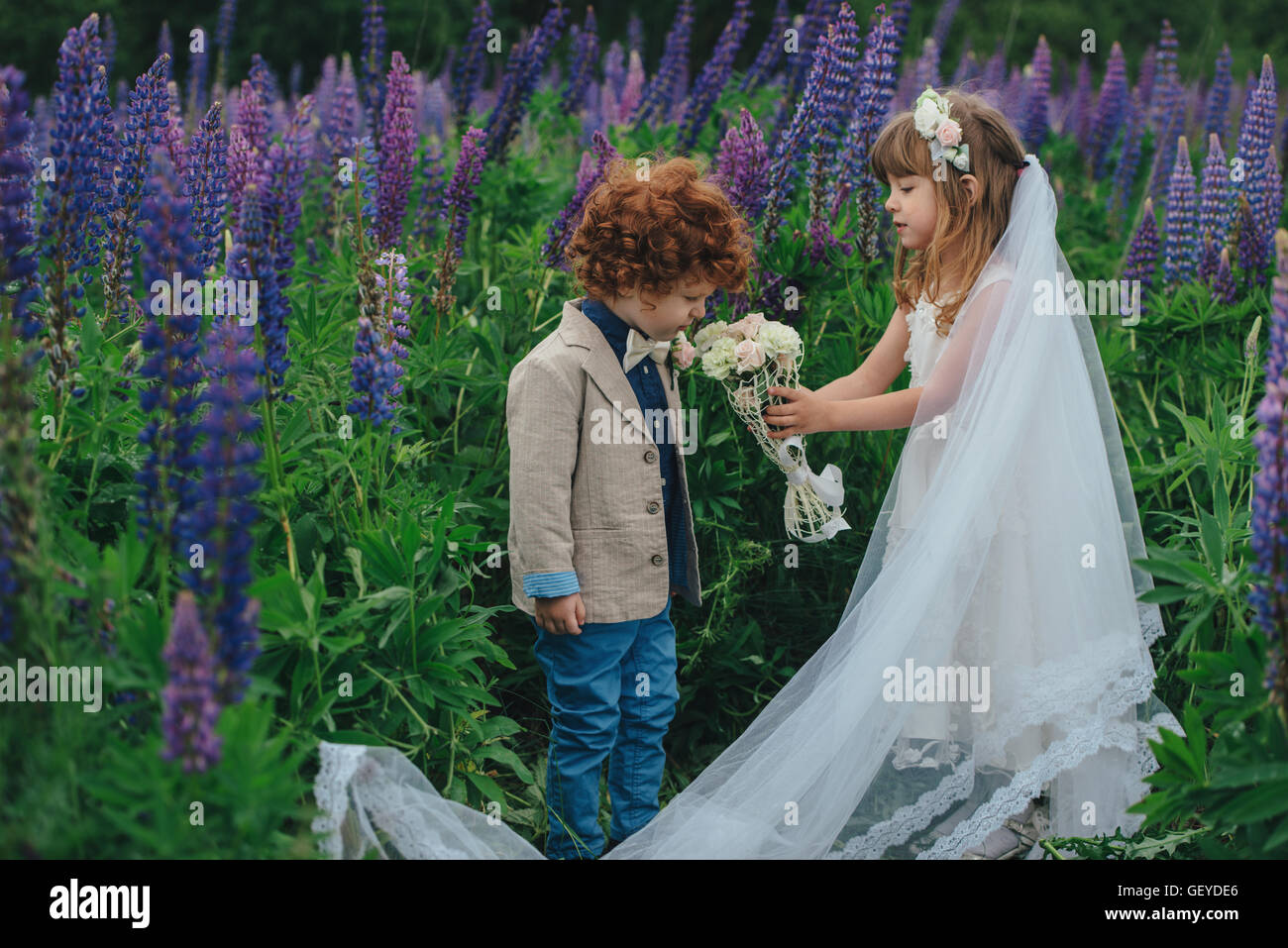 two funny little bride and groom Stock Photo - Alamy