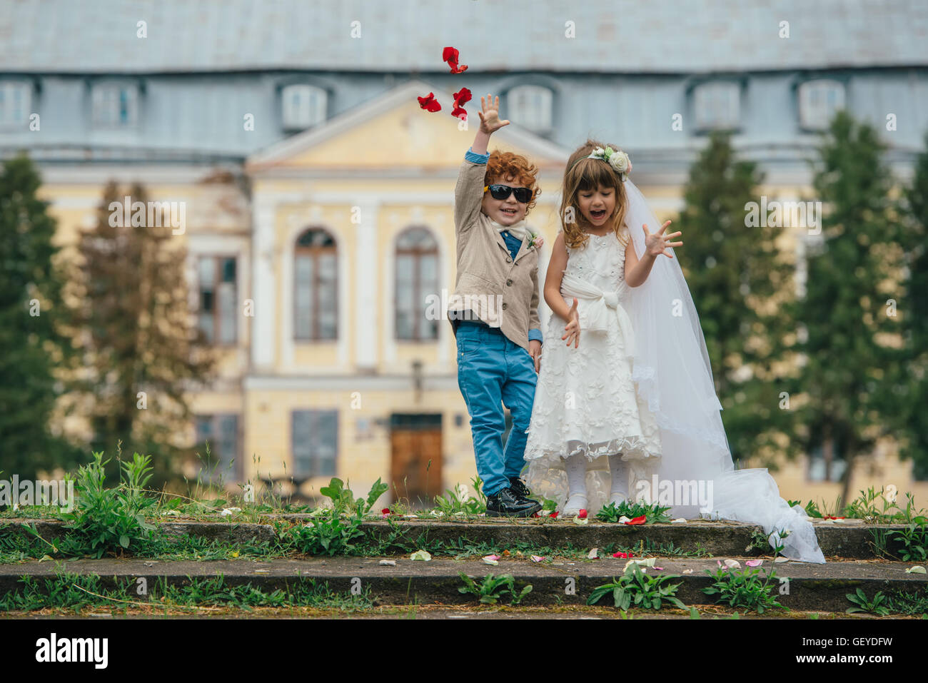 two funny little bride and groom Stock Photo - Alamy