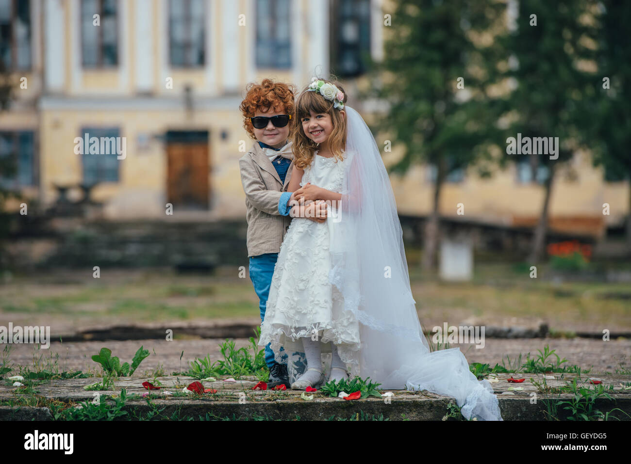 two funny little bride and groom Stock Photo - Alamy