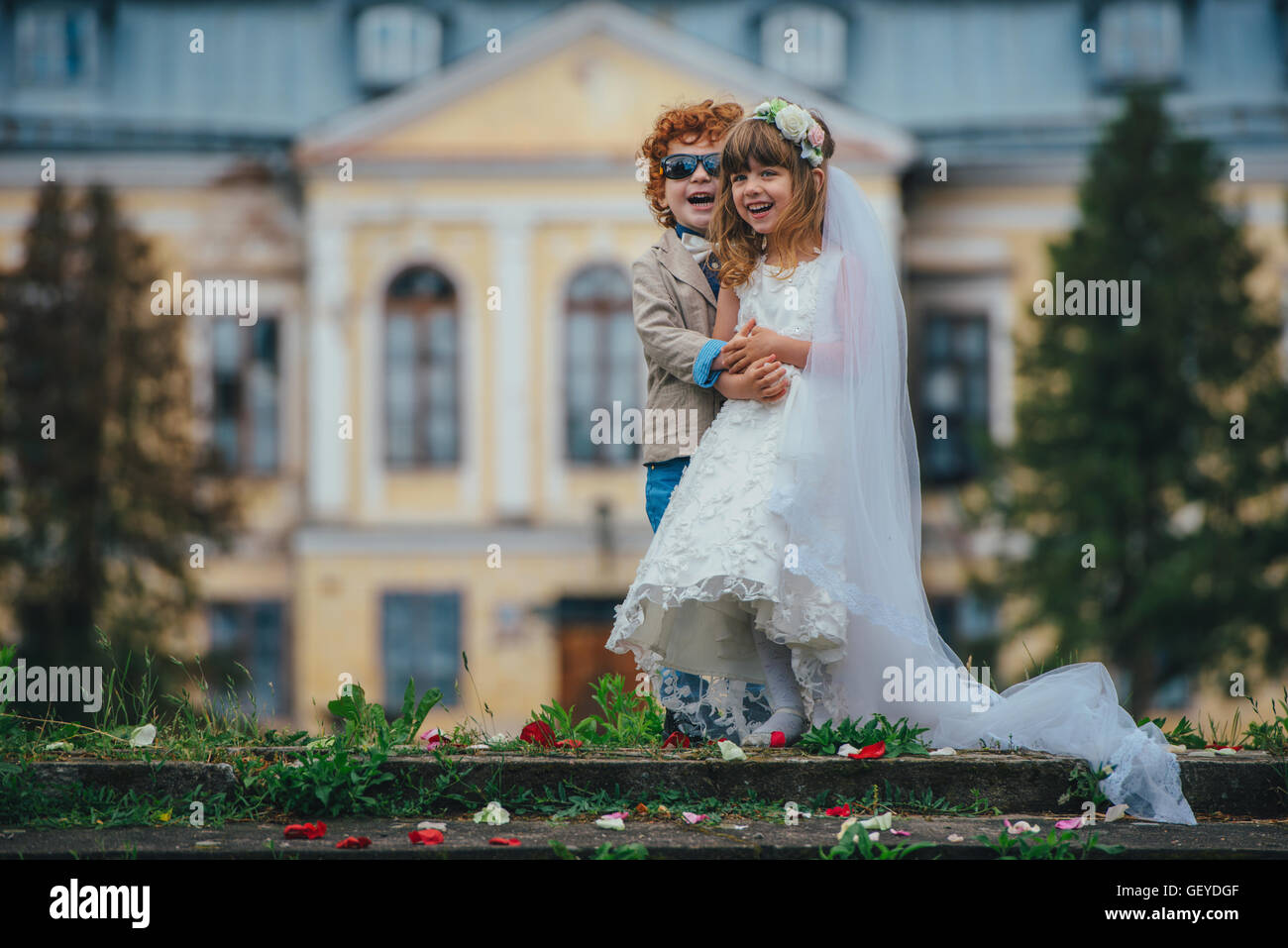 two funny little bride and groom Stock Photo - Alamy