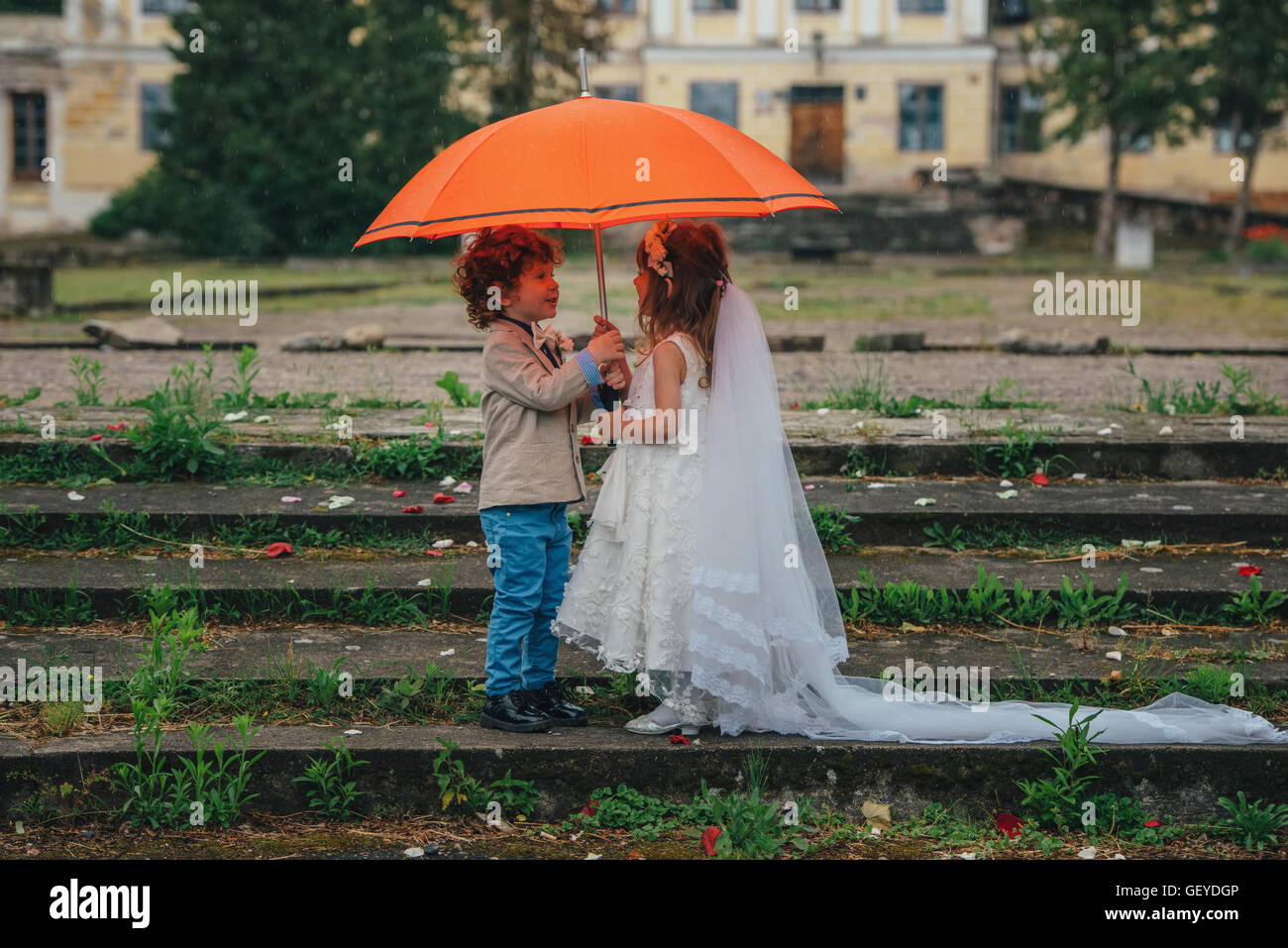 two funny little bride and groom Stock Photo - Alamy