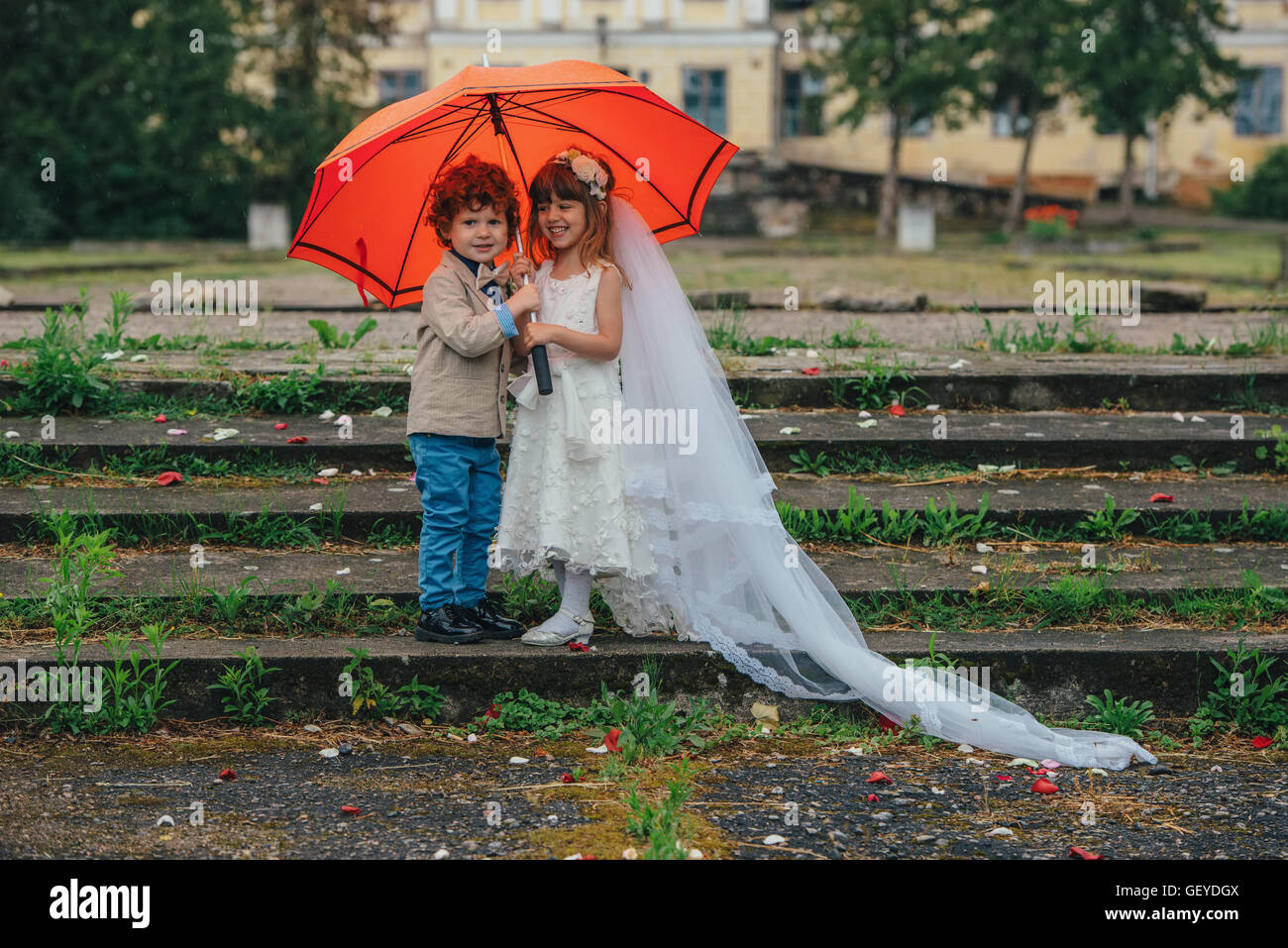 two funny little bride and groom Stock Photo - Alamy