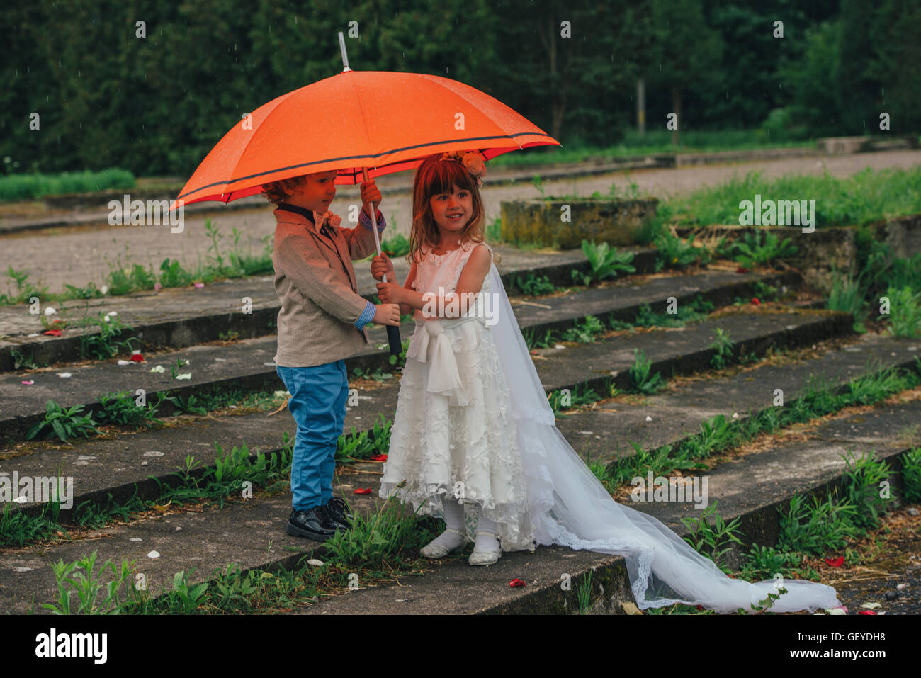 two funny little bride and groom Stock Photo - Alamy