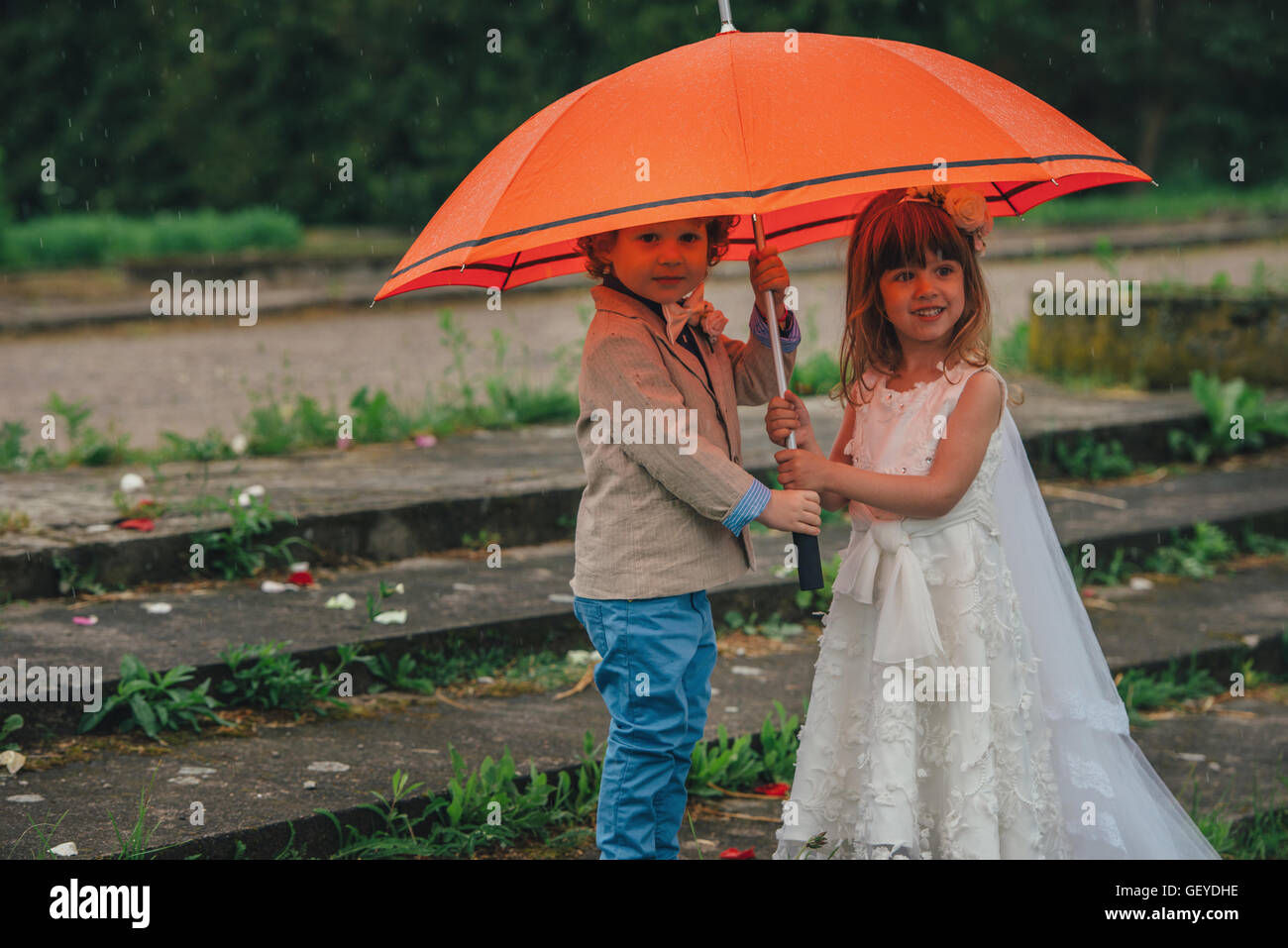 two funny little bride and groom Stock Photo - Alamy