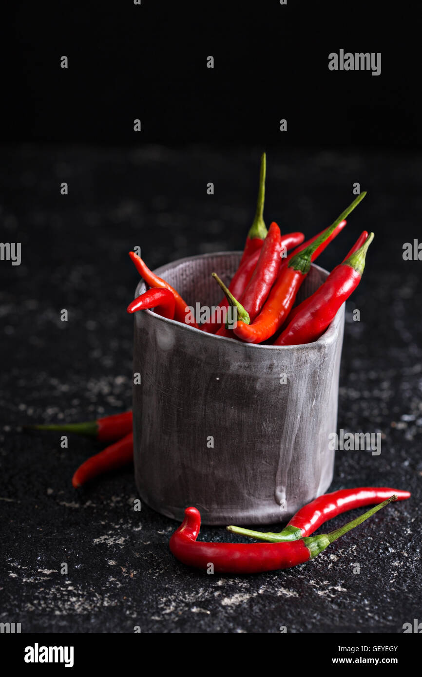 Red chili peppers in a cup Stock Photo - Alamy
