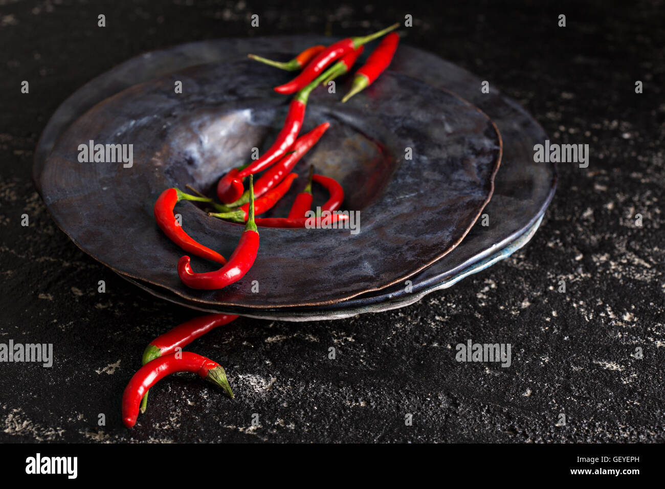 Red chili peppers in a cup Stock Photo - Alamy