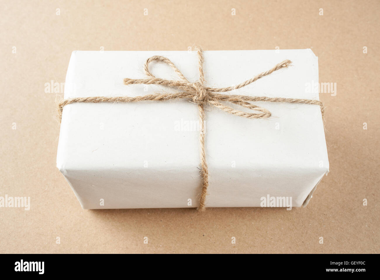 isolated gift box on cardboard Stock Photo - Alamy