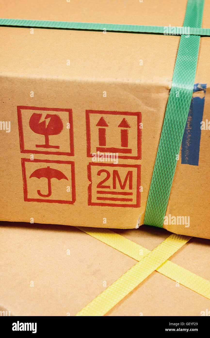 closeup detail of freight parcel with plastic strap Stock Photo - Alamy
