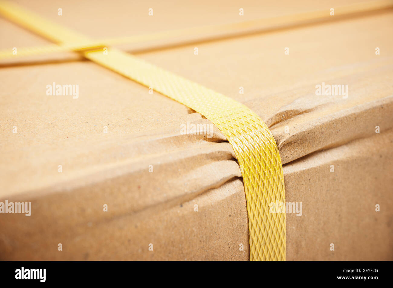 closeup detail of freight parcel with plastic strap Stock Photo - Alamy