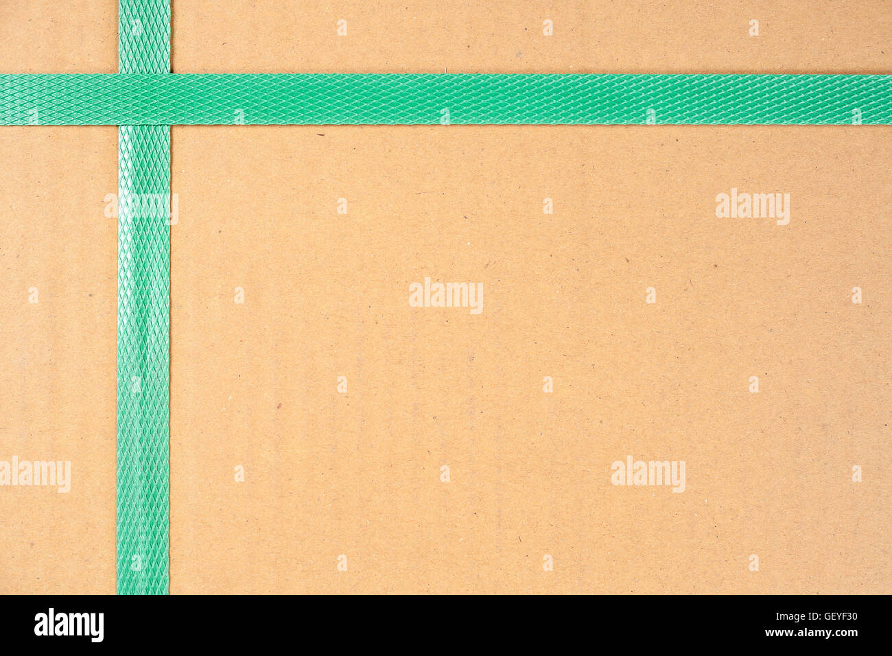 freight parcel with plastic strap background Stock Photo - Alamy