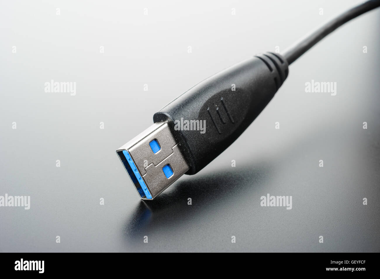 usb 3.0 cable isolated on black Stock Photo - Alamy