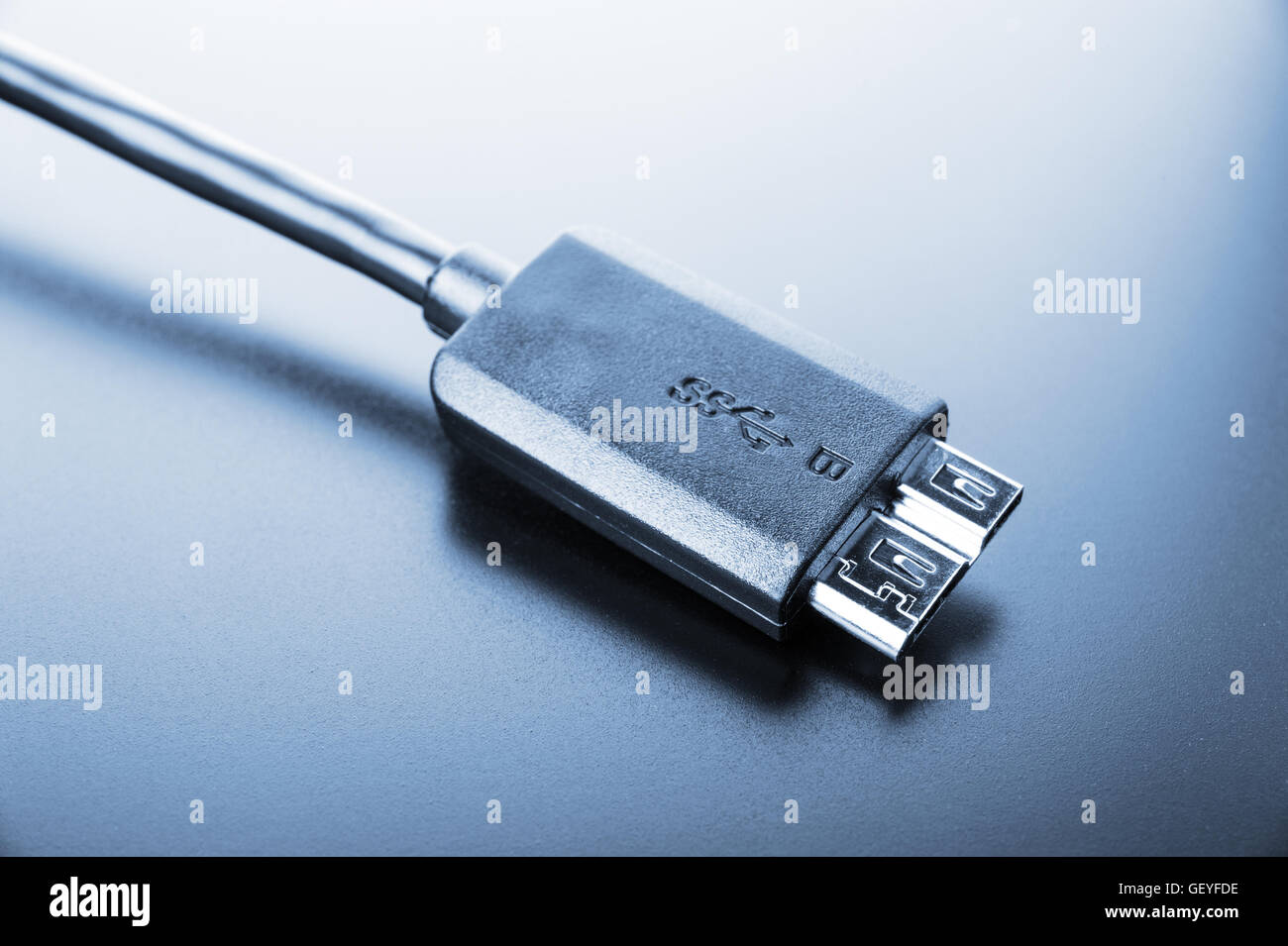 isolated usb 3.0 cable in cyan tone Stock Photo - Alamy