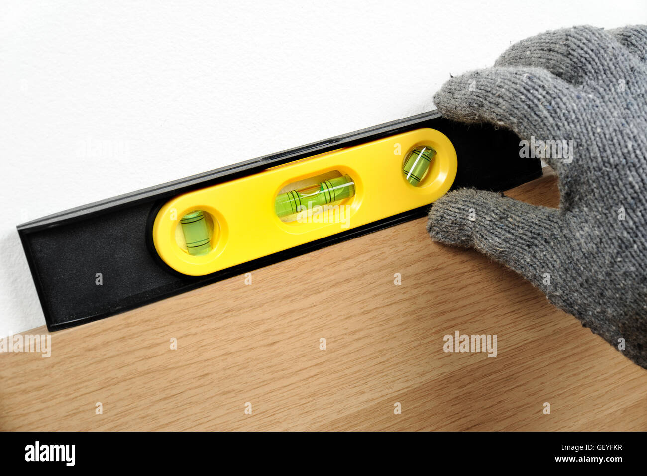 closeup spirit level on wooden furniture Stock Photo - Alamy