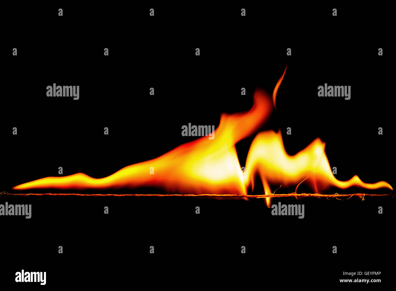 fire burning the rope on black background Stock Photo - Alamy
