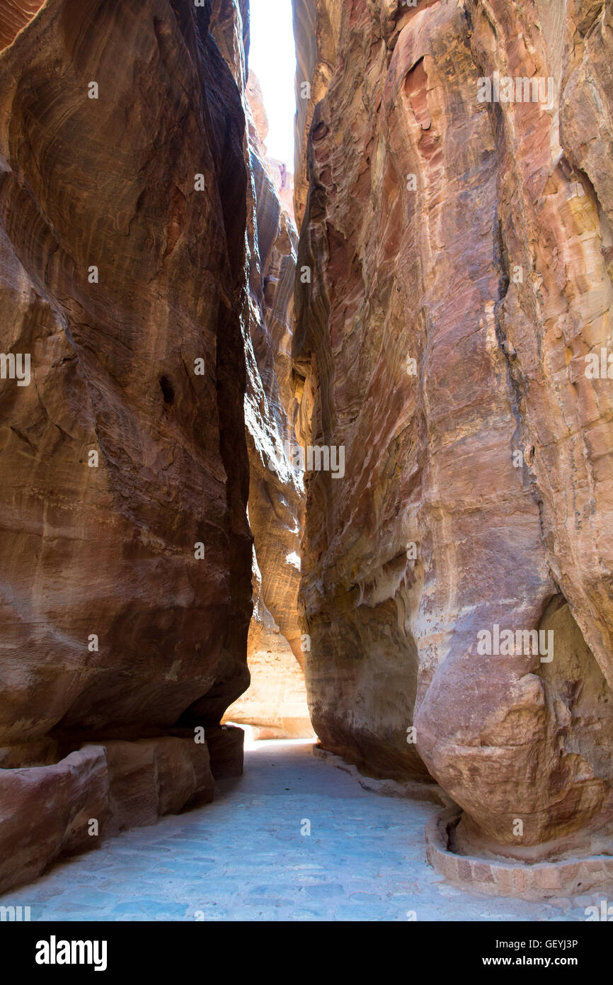 Pathway Amidst Rocky Mountains Stock Photo - Alamy