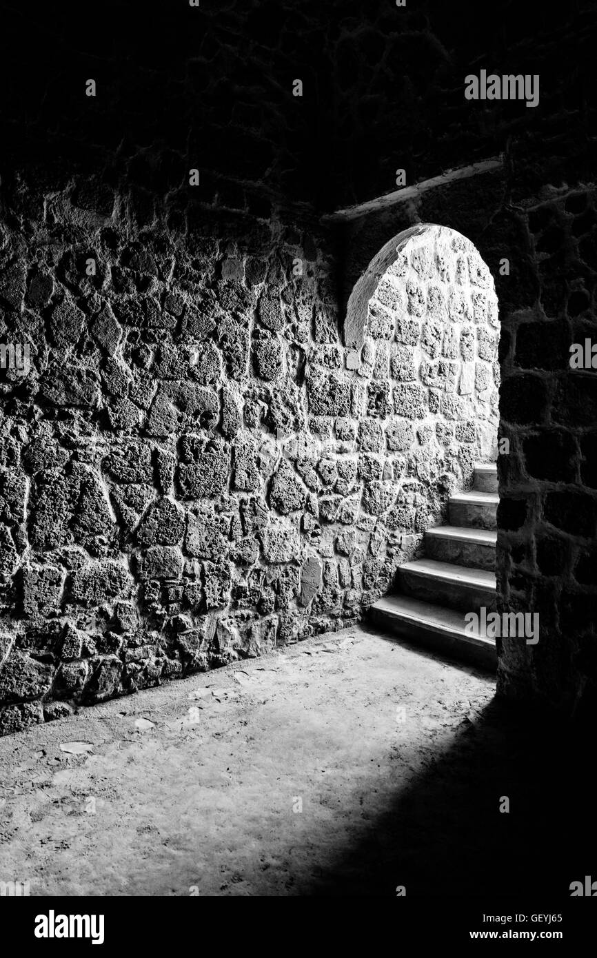 Sunlight Falling Through Arch And Stone Wall Stock Photo - Alamy