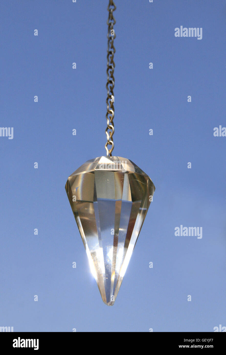 Quartz crystal, quartz, clear quartz, pendulum Stock Photo - Alamy
