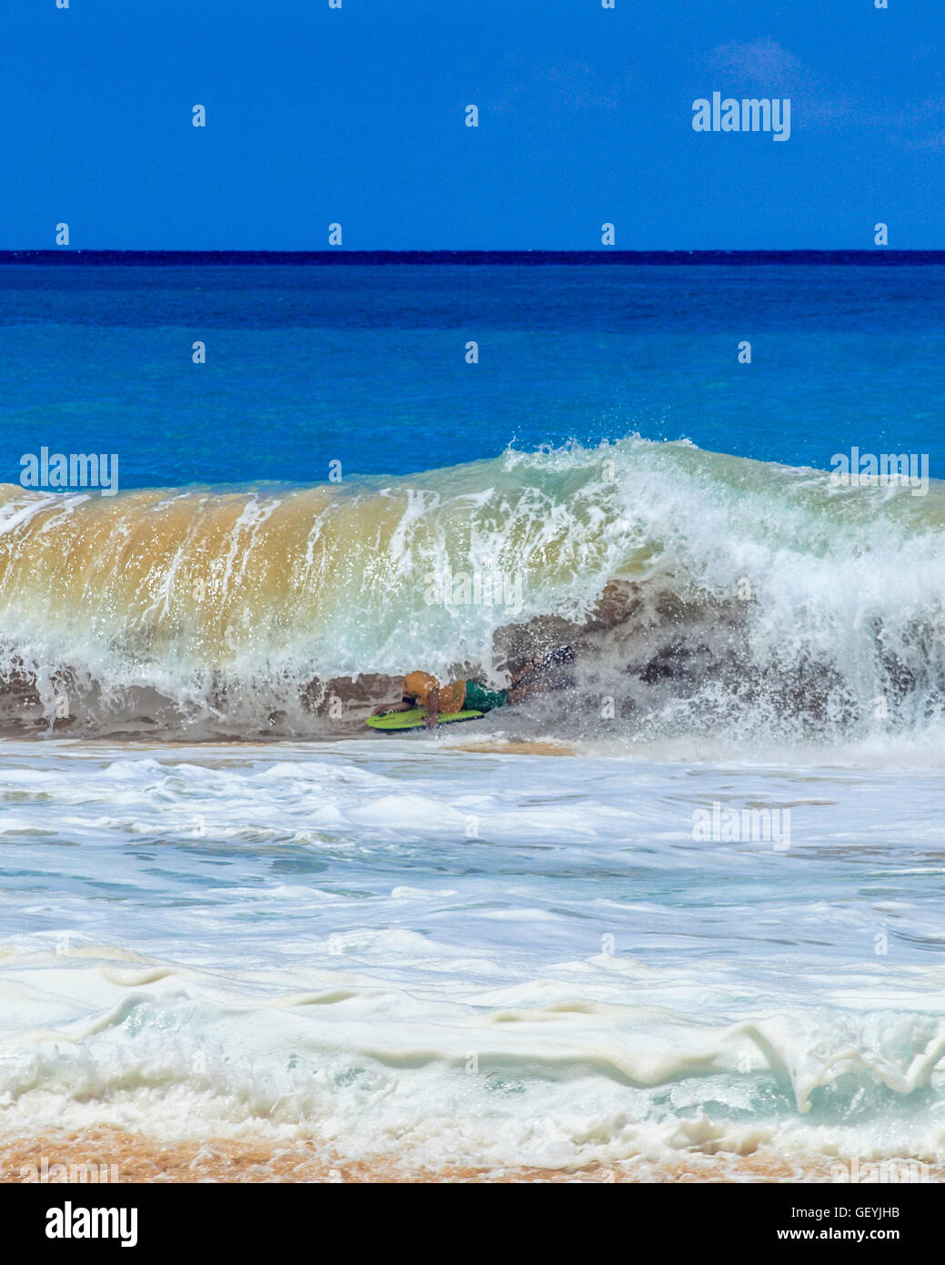 Man inside curl of breaking wave at Big Beach at Makena State Park ...