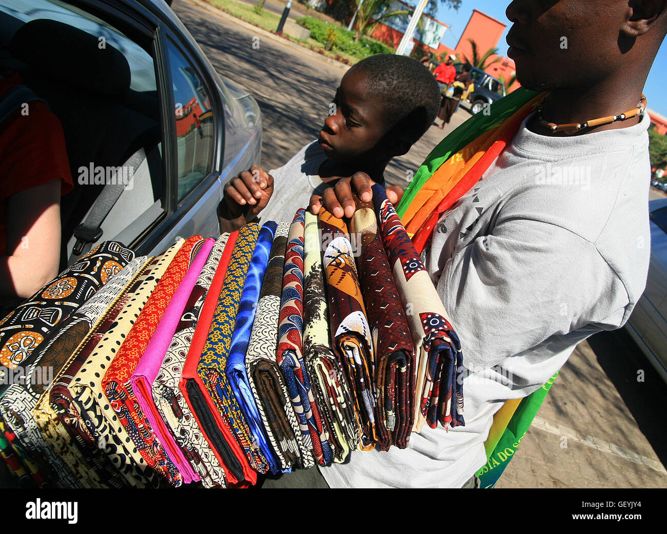 Hawker selling fabric, Maputo, Mozambique Stock Photo - Alamy