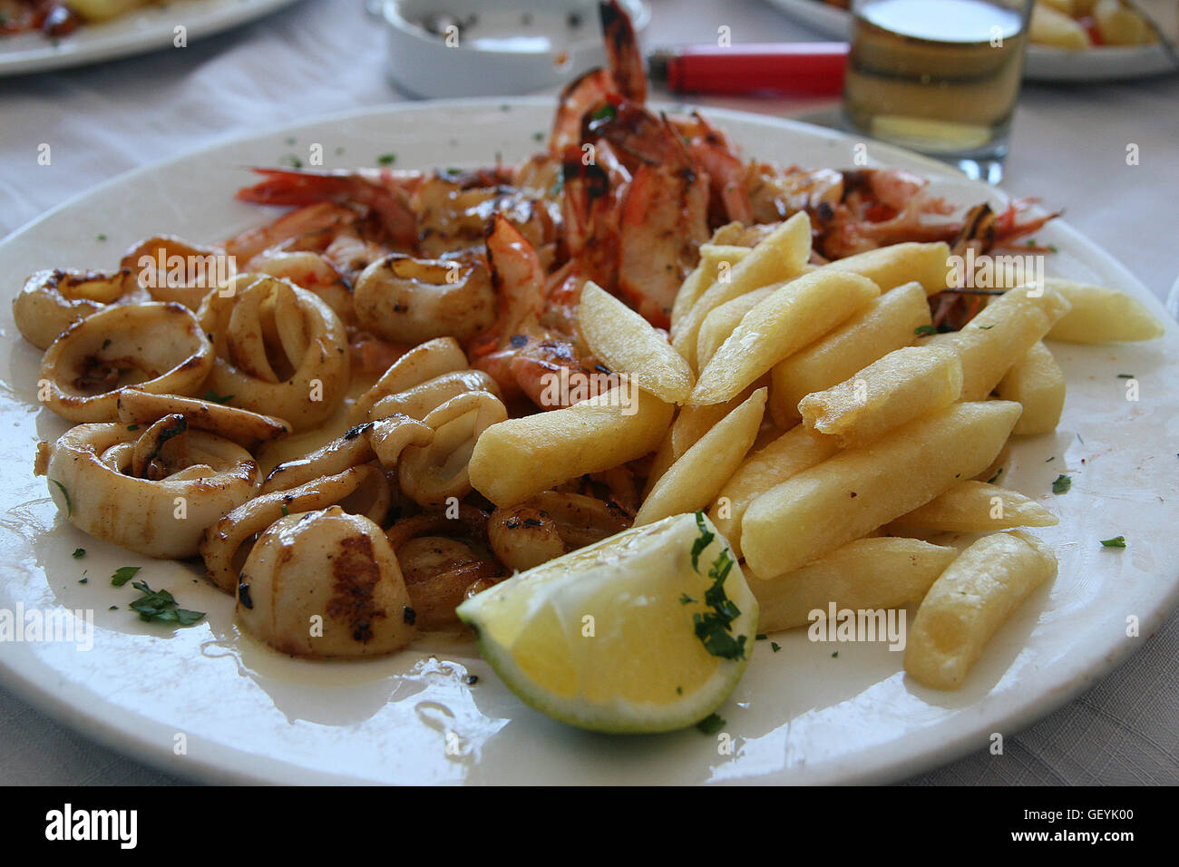 Prawns and calamari on plate, Maputo, Mozambique Stock Photo - Alamy
