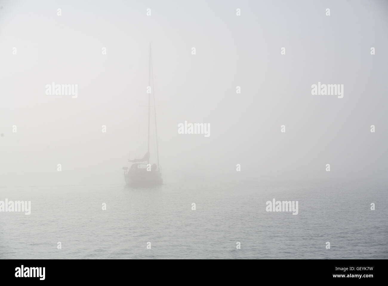 Sail Boat in Fog Stock Photo - Alamy