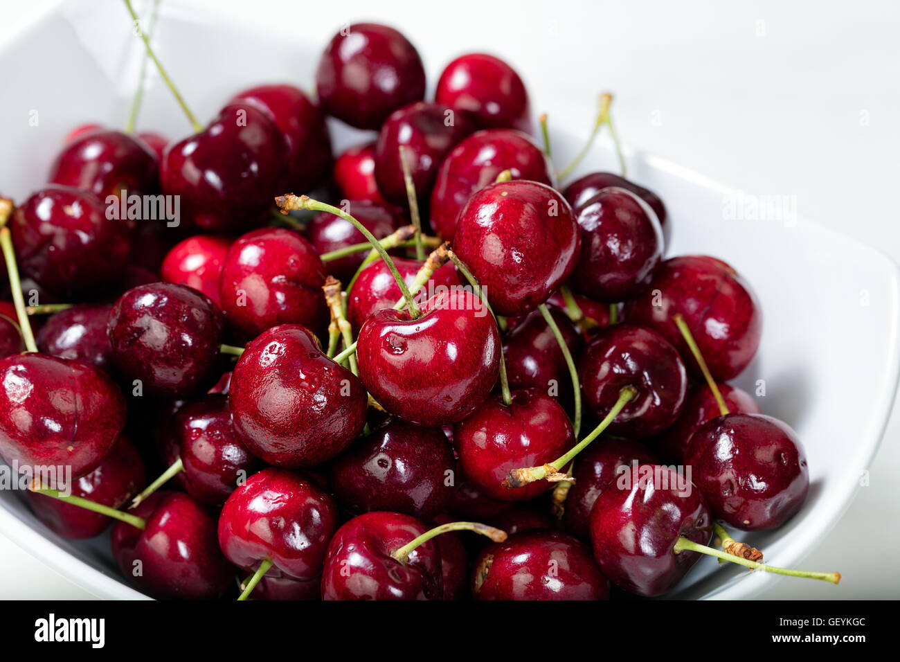 Close up view of a bowl of ripe cherries. Selective focus on front ...