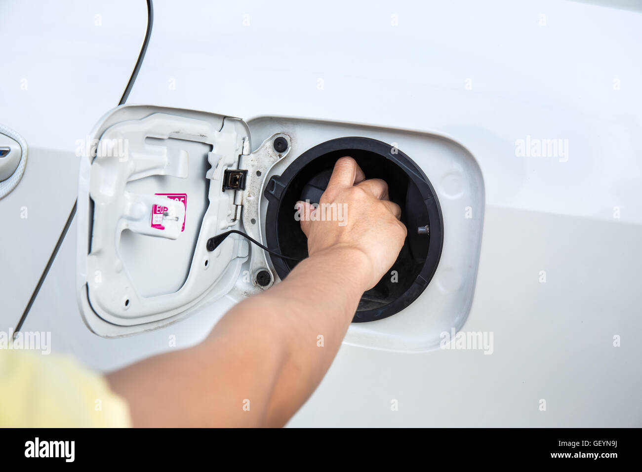 Woman opening car gas tank hi-res stock photography and images - Alamy