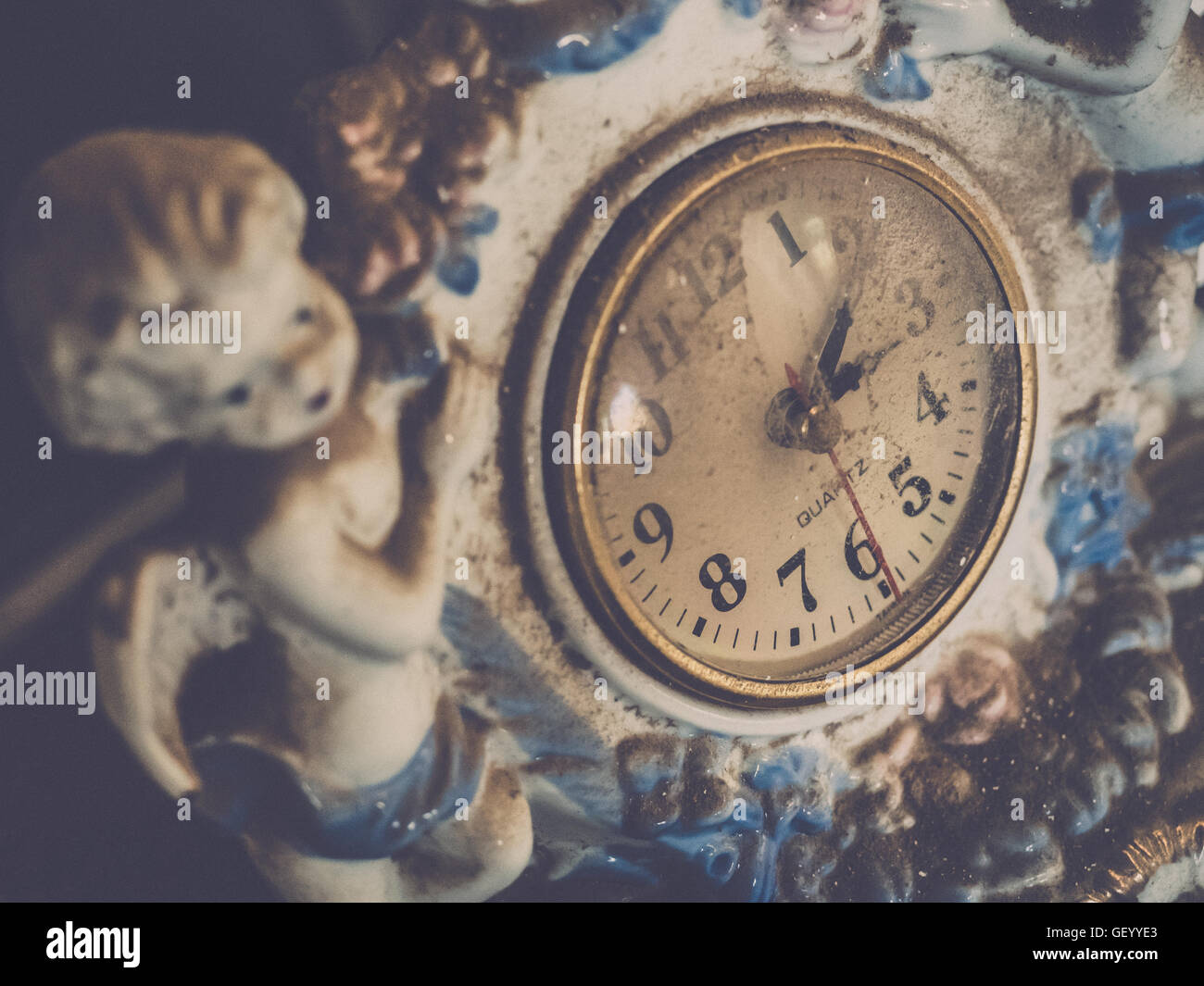 Old vintage porcelain watch with a angel figure attached Stock Photo ...