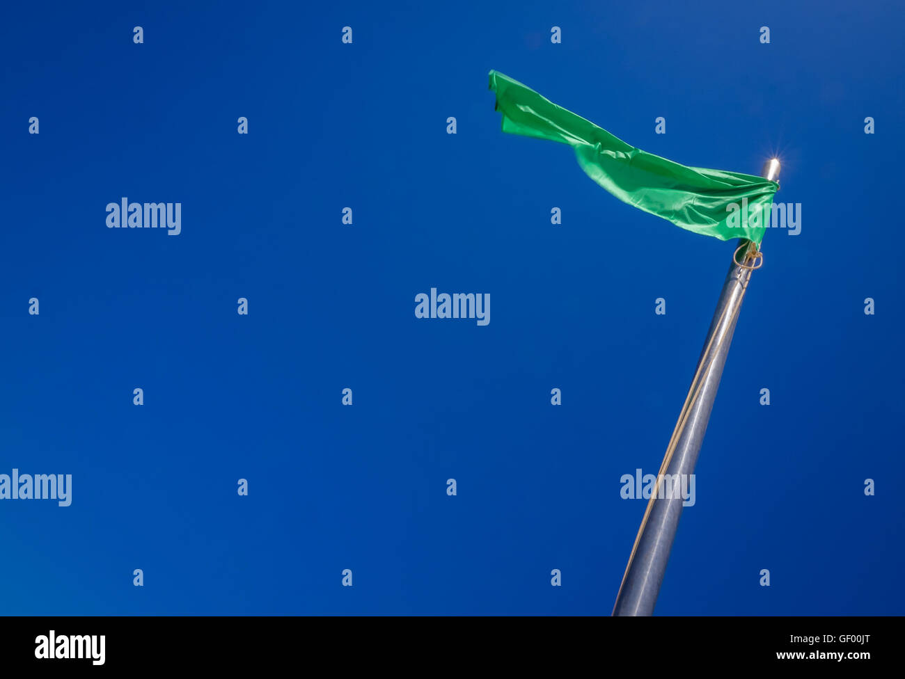 Green flag on the beach in Corralejo indicating that swimming is ...