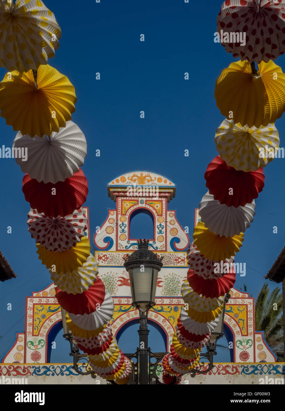 Colorful decorations hanging between traditional old buildings during ...