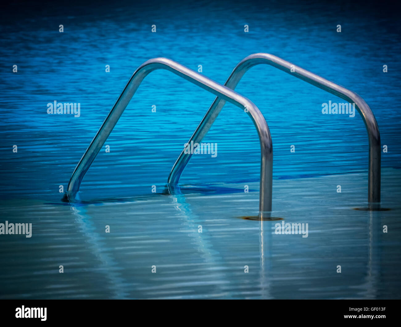 Detail of swimming pool ladder in a holiday resort Stock Photo - Alamy