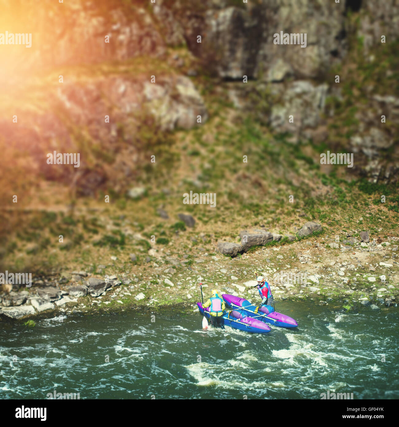 People rafting river rapids. Extreme tourism. Eco tourism. Tilt-shift ...