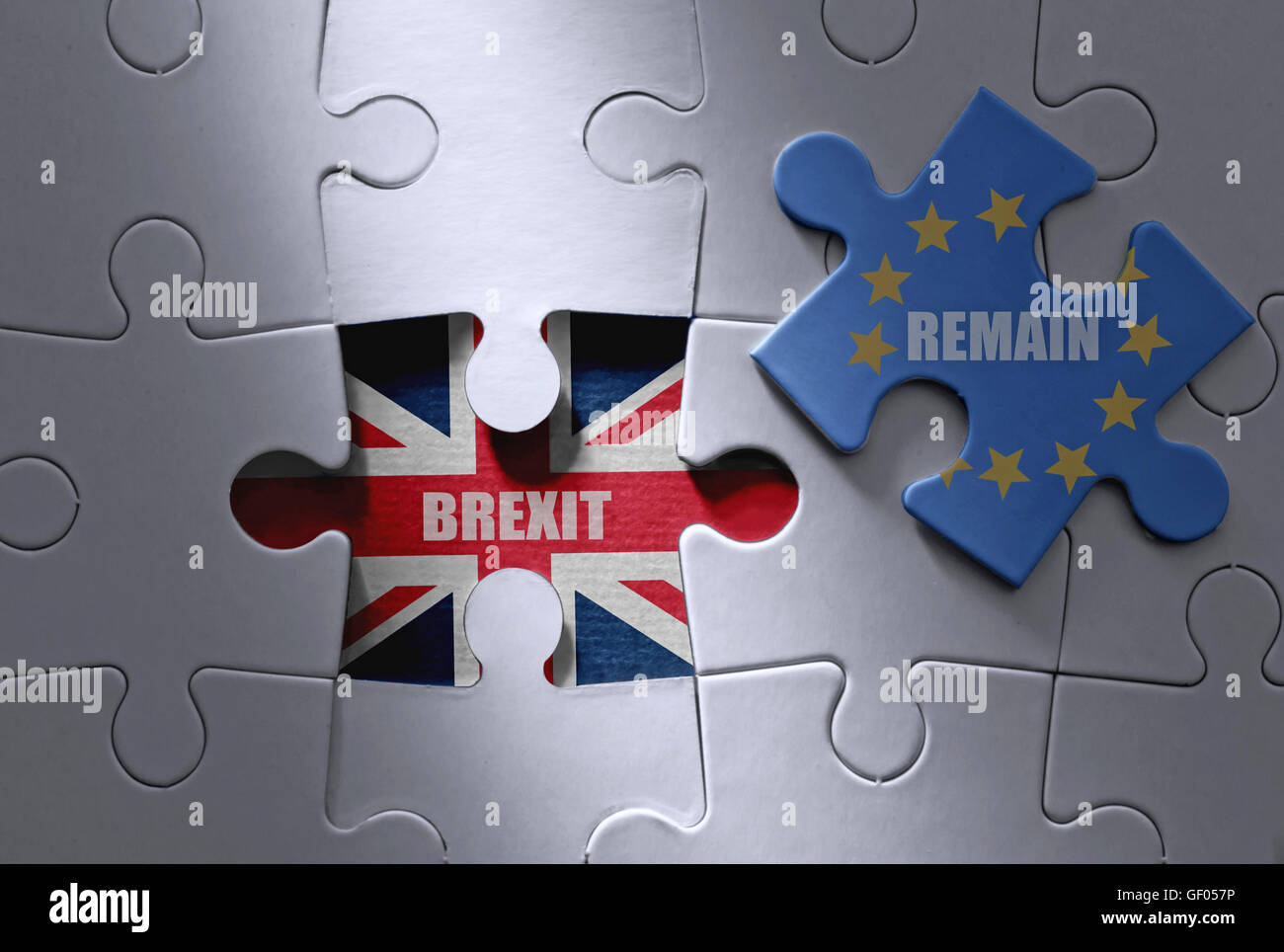 Brexit concept, european flag jigsaw piece with British flag underneath ...