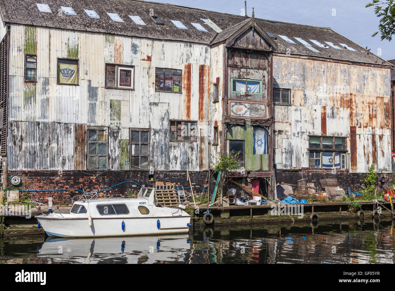 old corrugated industrial building on riverside of river wensum norwich ...
