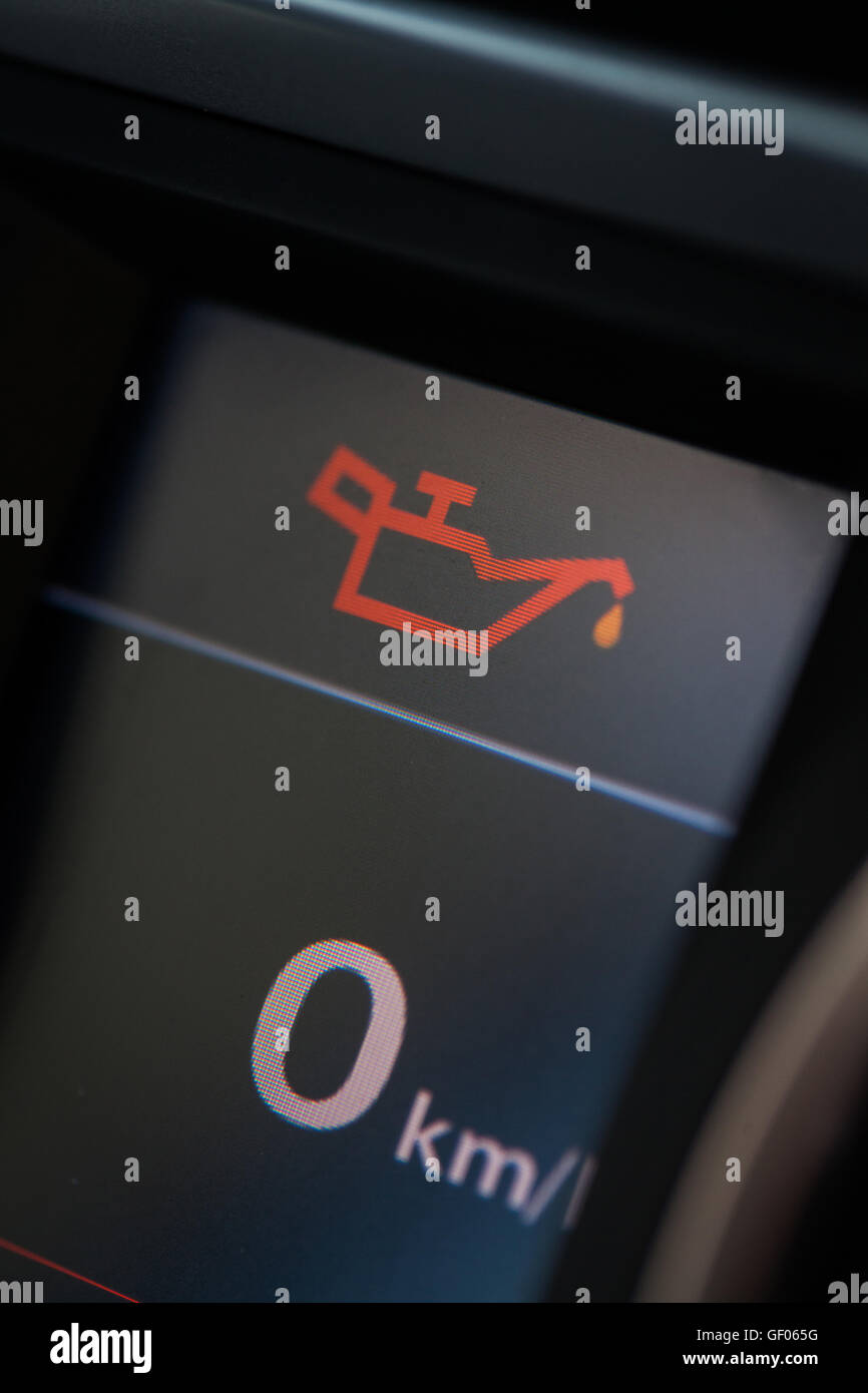 Detail of the dashboard of a car, with the oil alert icon lit up Stock ...
