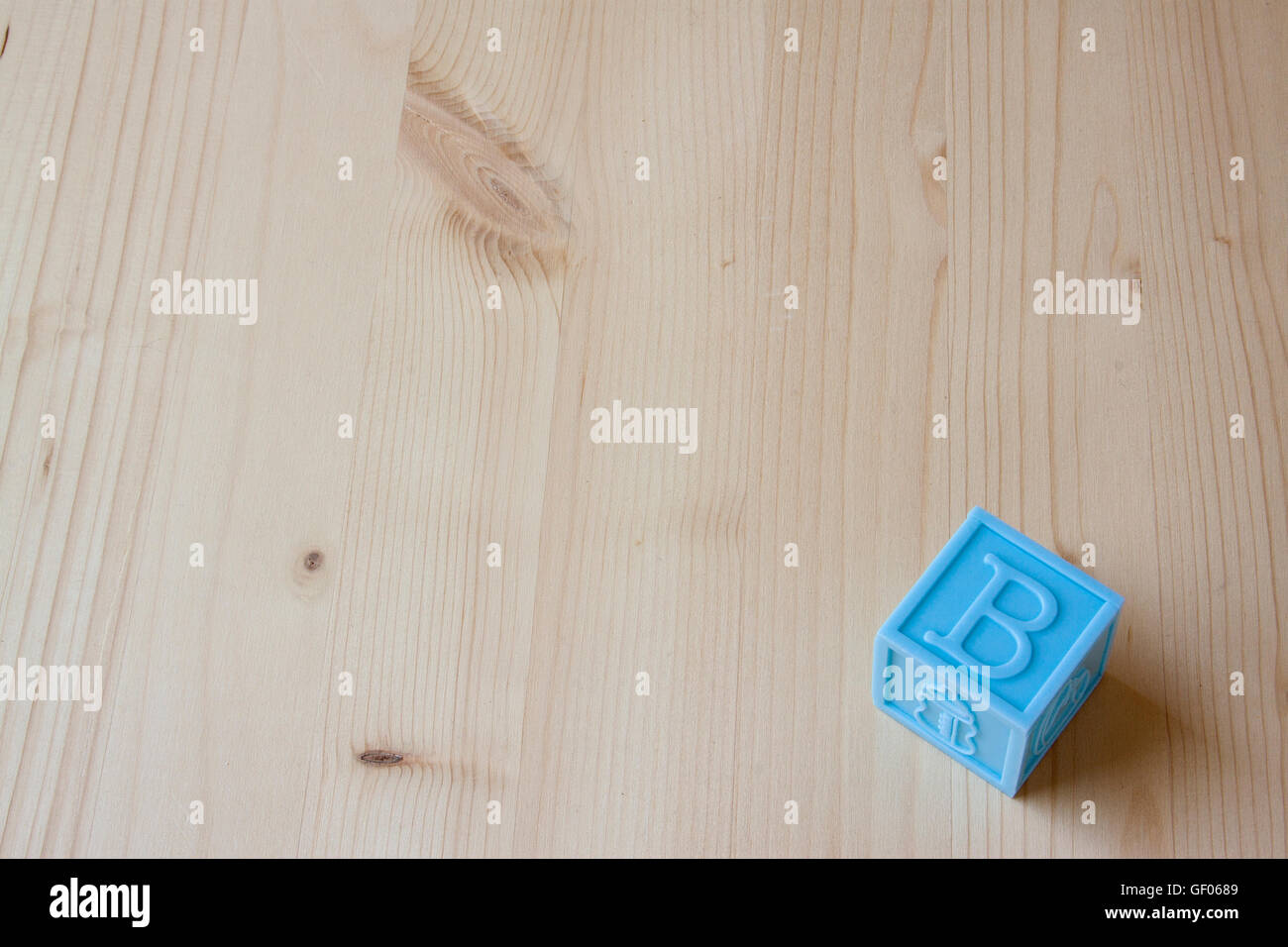 Blue Baby Blocks on a Wooden Background Stock Photo - Alamy