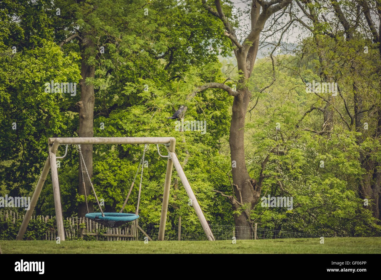 Large swing in an outdoor playground near forest Stock Photo - Alamy