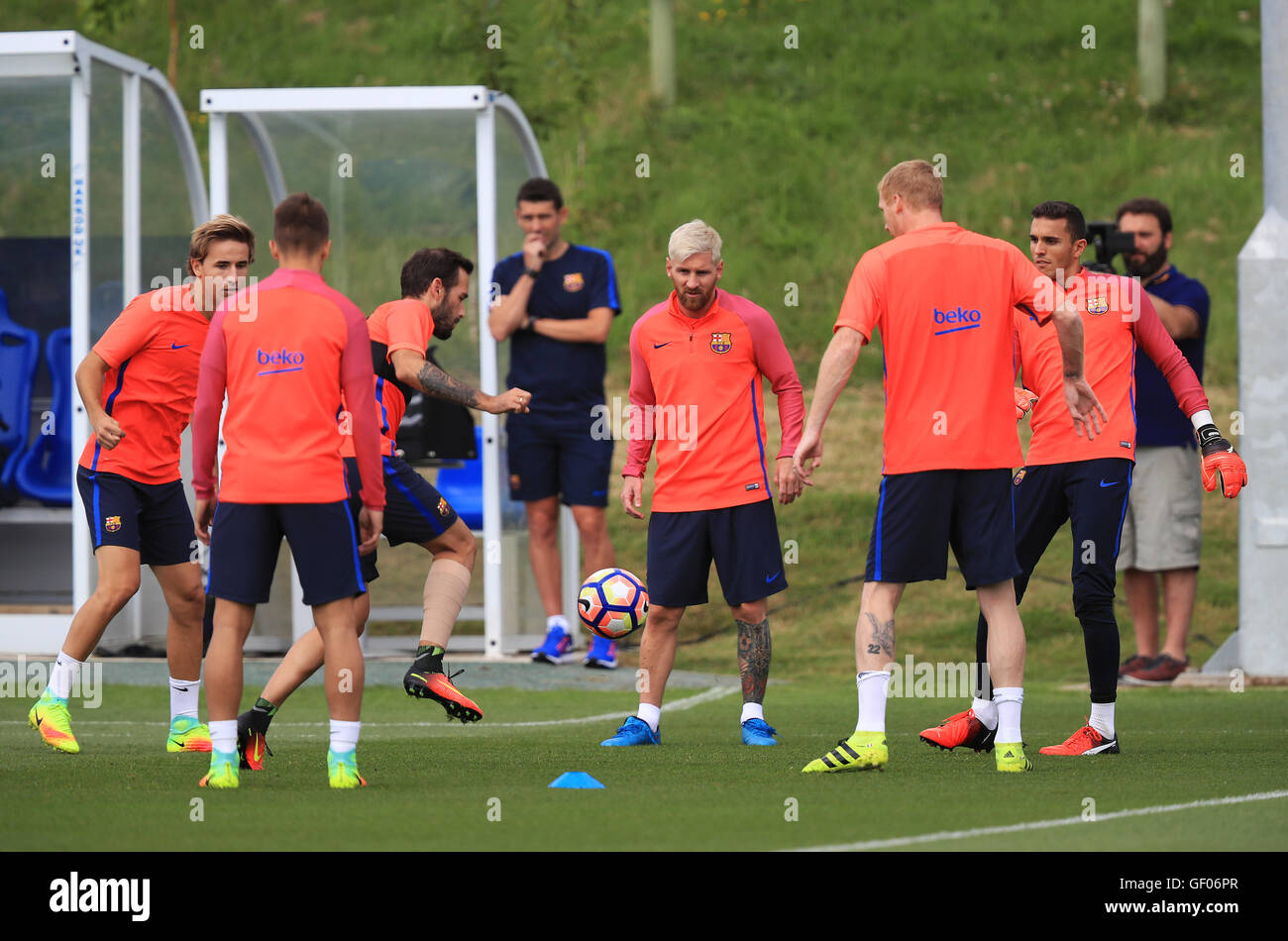 Barcelona's Lionel Messi (centre) and his team-mates during a training ...