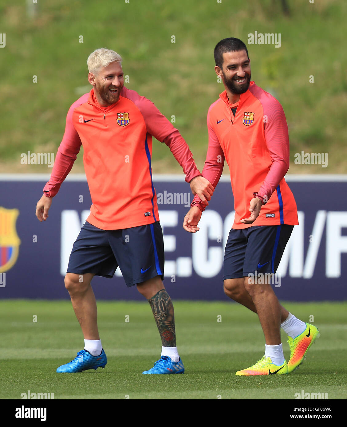 Barcelona's Lionel Messi (left) and Arda Turan during a training ...