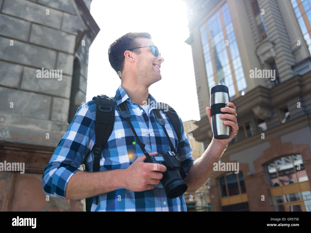 Positive man having a walk Stock Photo - Alamy