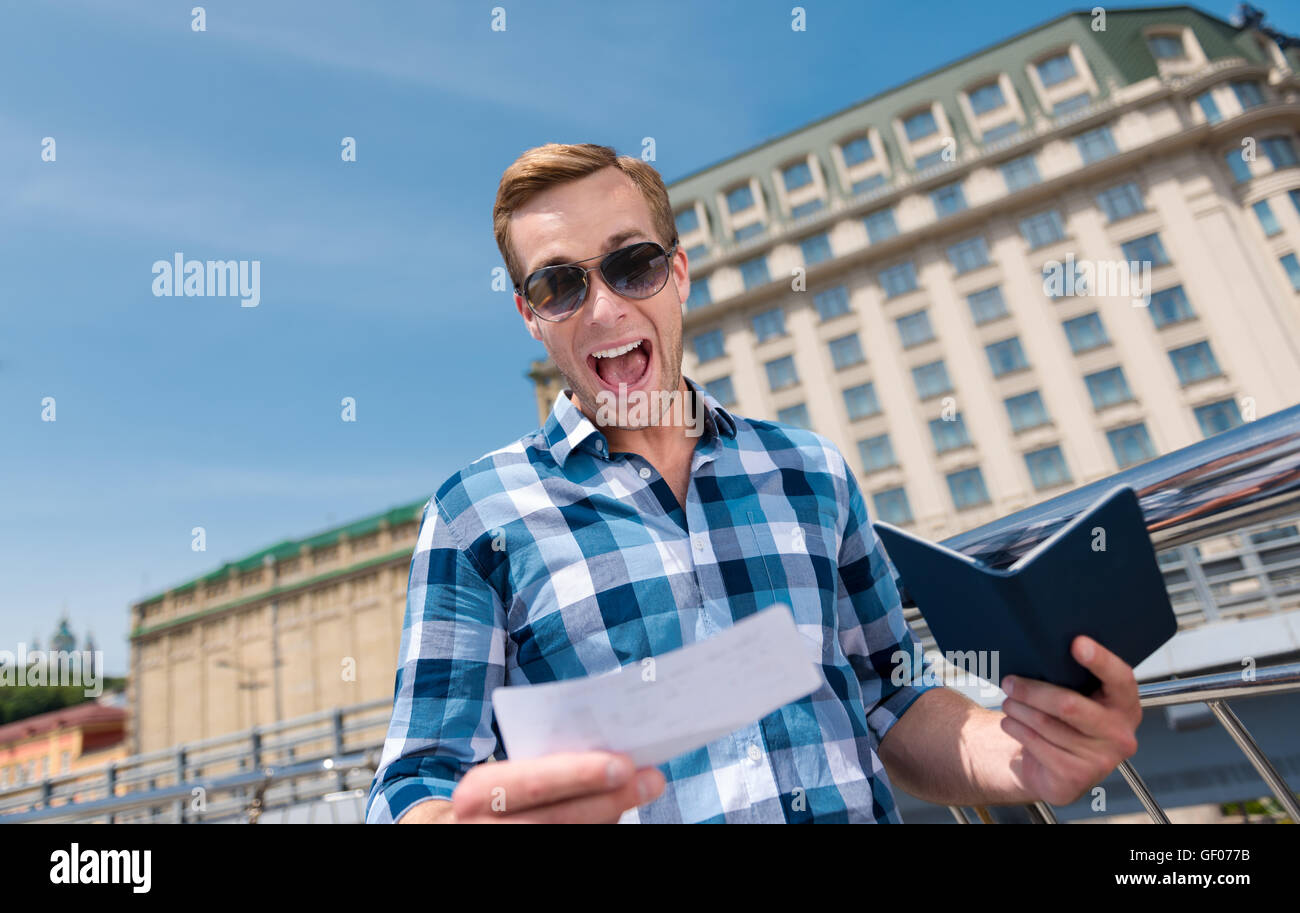 Positive man holding paper Stock Photo - Alamy