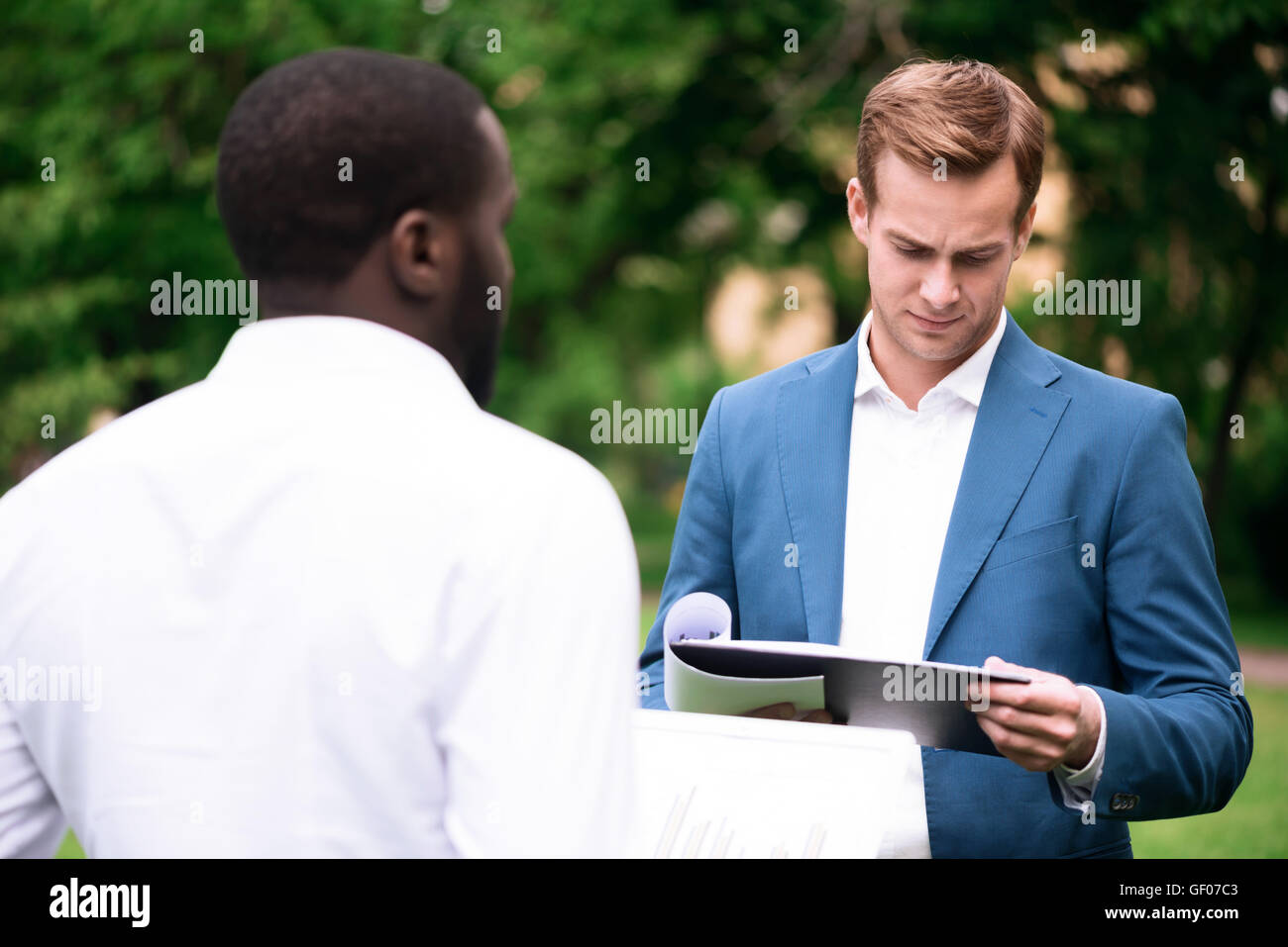 Concentrated colleagues working on the project Stock Photo - Alamy