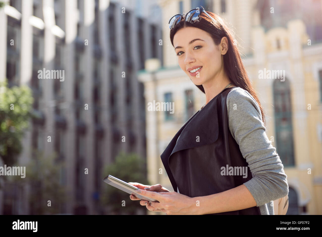 Positive beautiful woman standing in the street Stock Photo - Alamy