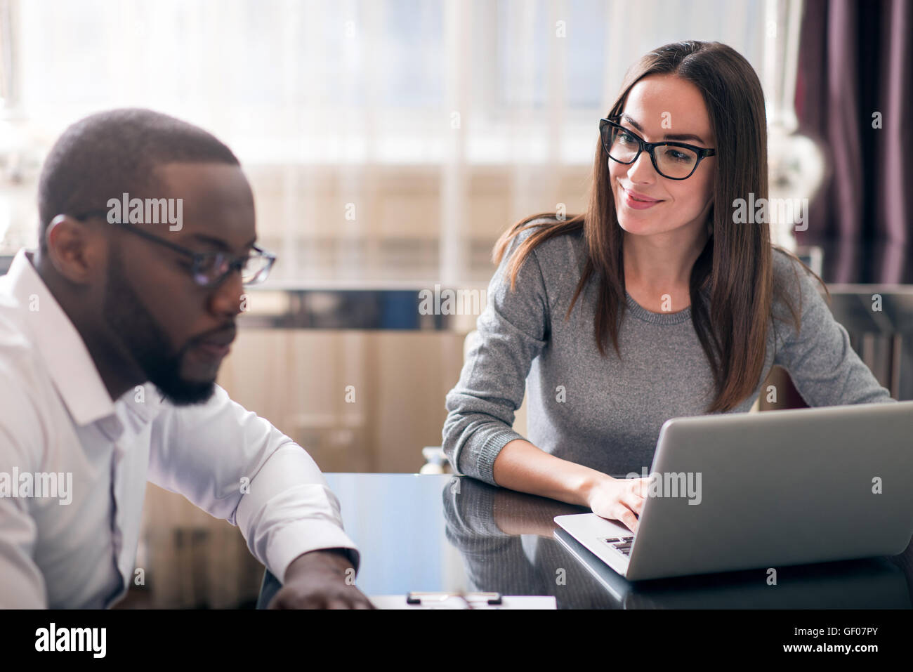 Man and woman working together Stock Photo - Alamy