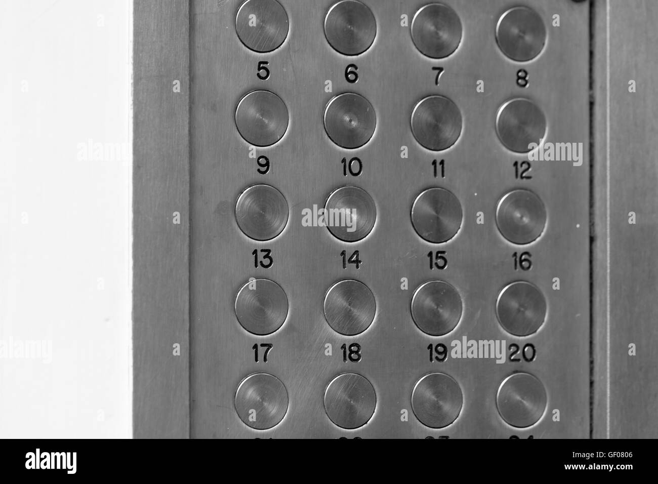 Push buttons outside large block of flats with numbers Stock Photo - Alamy